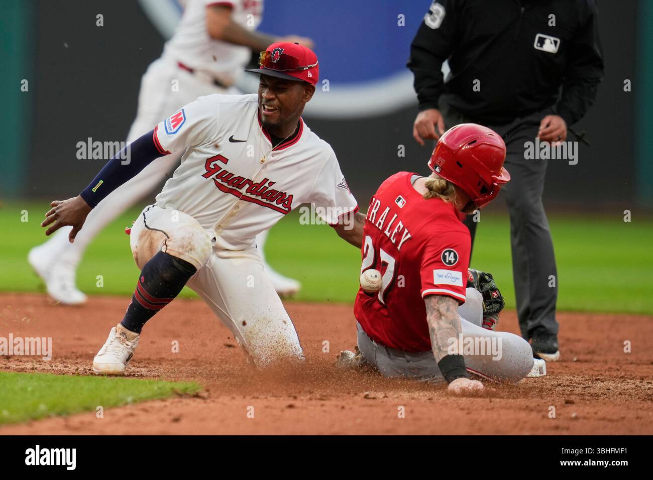Cincinnati Reds' Jake Fraley (27) steals second base next to Cleveland ...
