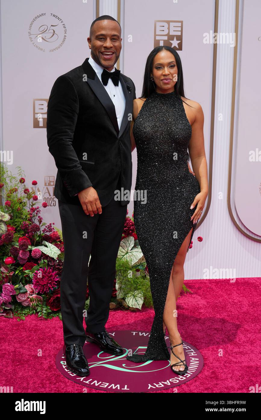 DeVon Franklin, left, and Maria Castillo arrive at the BET Awards on ...