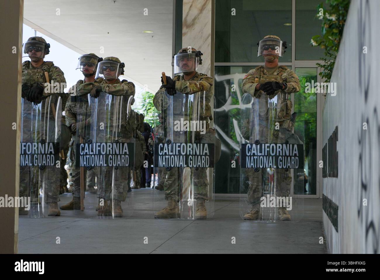 Protestors and California National Guard gather outside the Edward R ...
