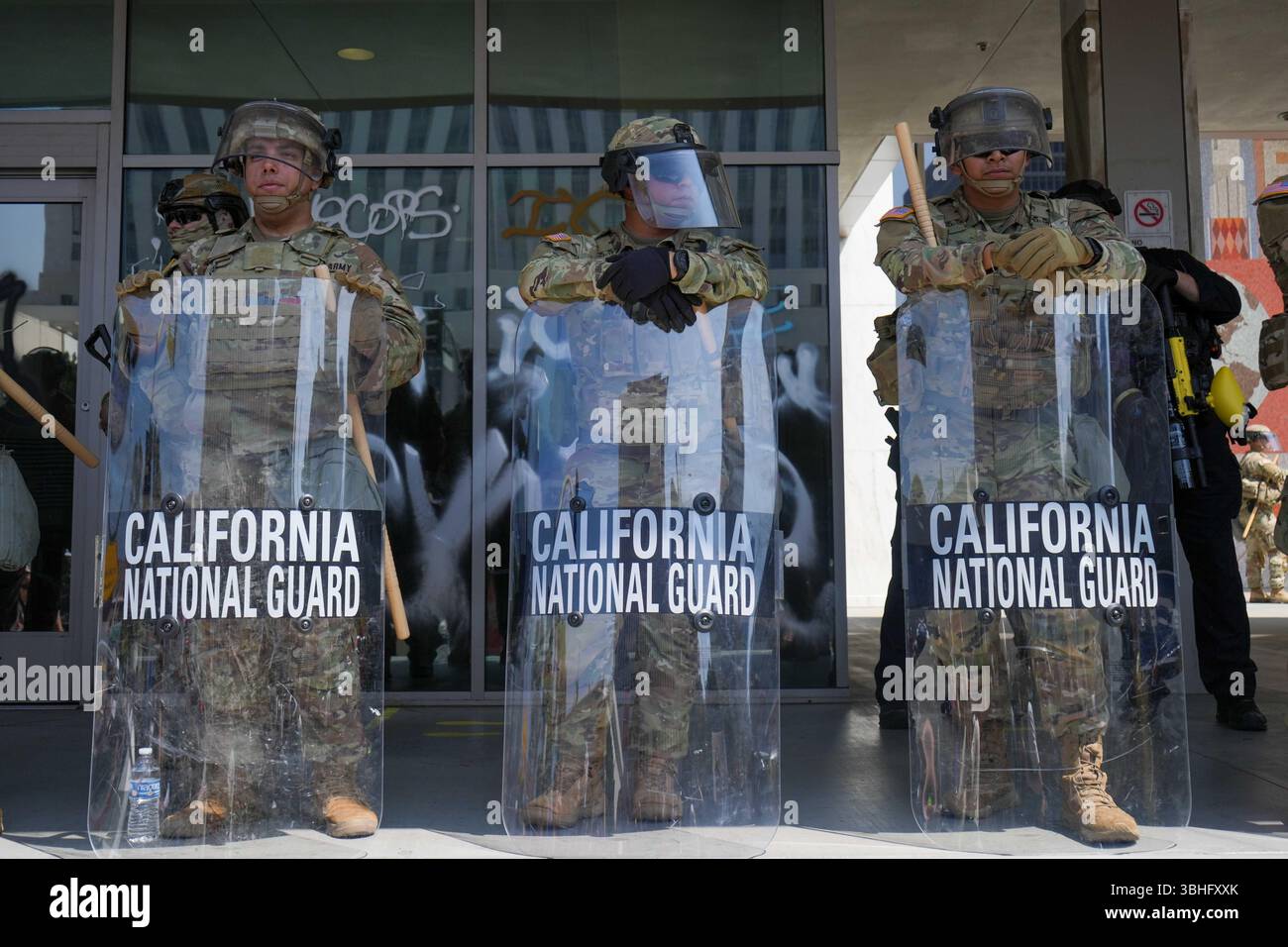 Protestors and California National Guard gather outside the Edward R ...