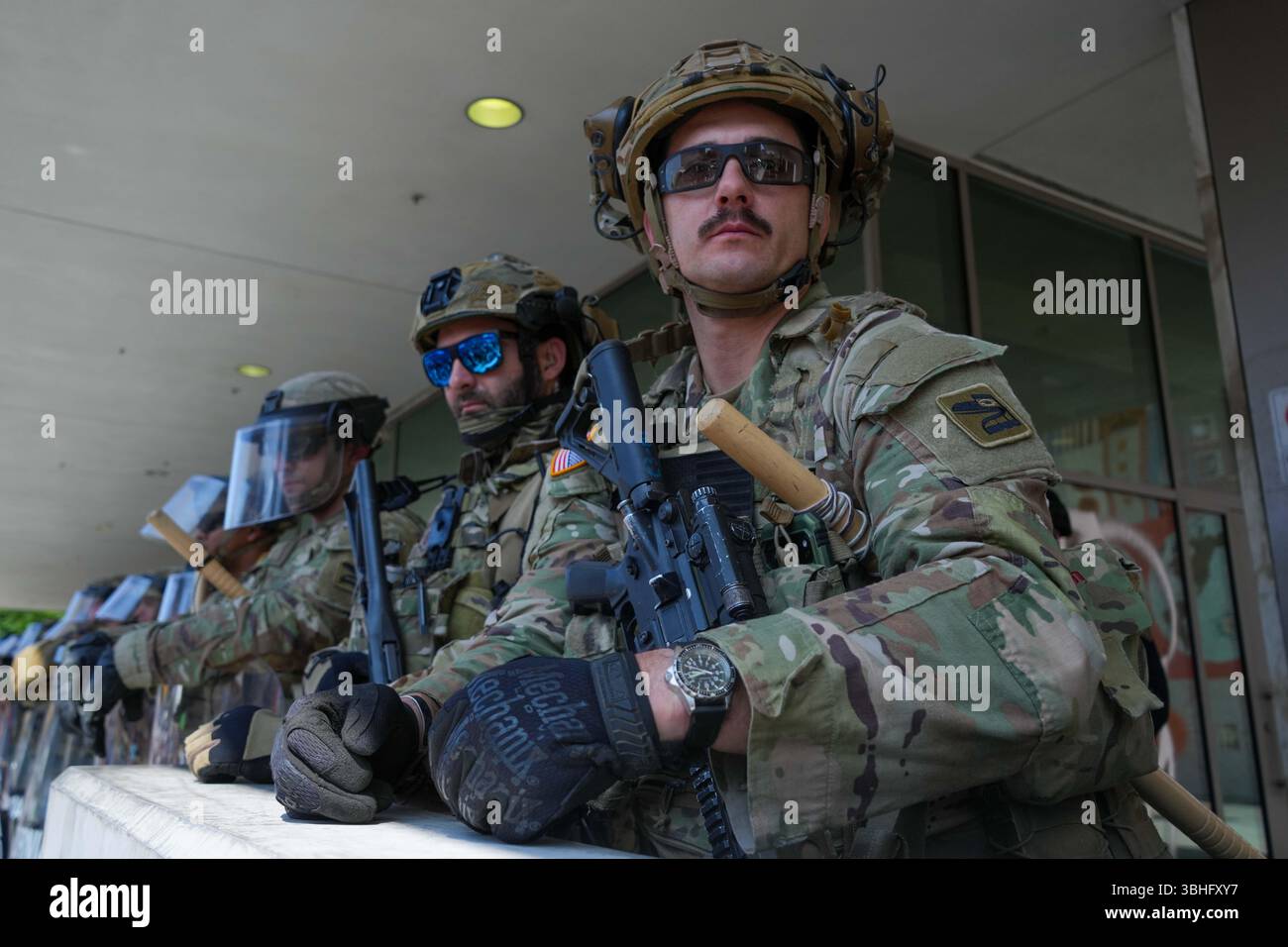 Protestors and California National Guard gather outside the Edward R ...