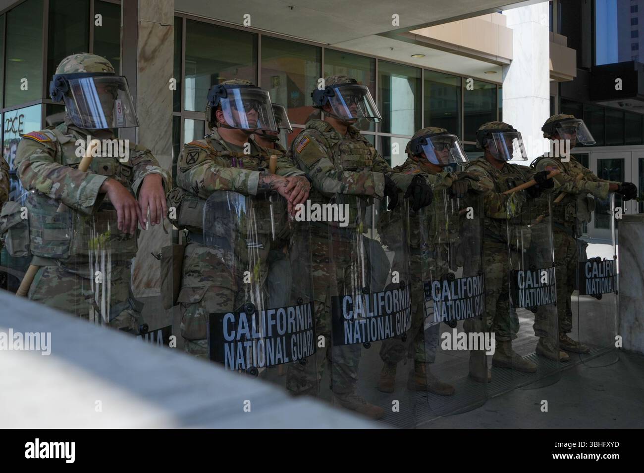 Protestors and California National Guard gather outside the Edward R ...