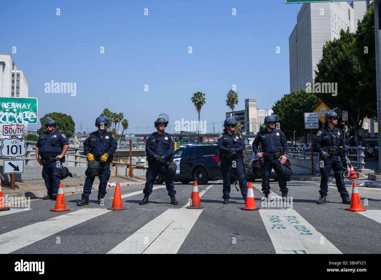 Protestors and California National Guard gather outside the Edward R ...
