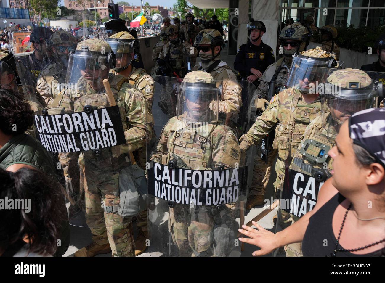 Protestors and California National Guard gather outside the Edward R ...