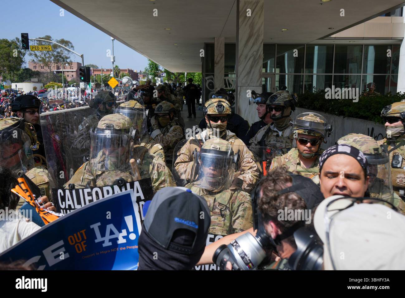 Protestors and California National Guard gather outside the Edward R ...