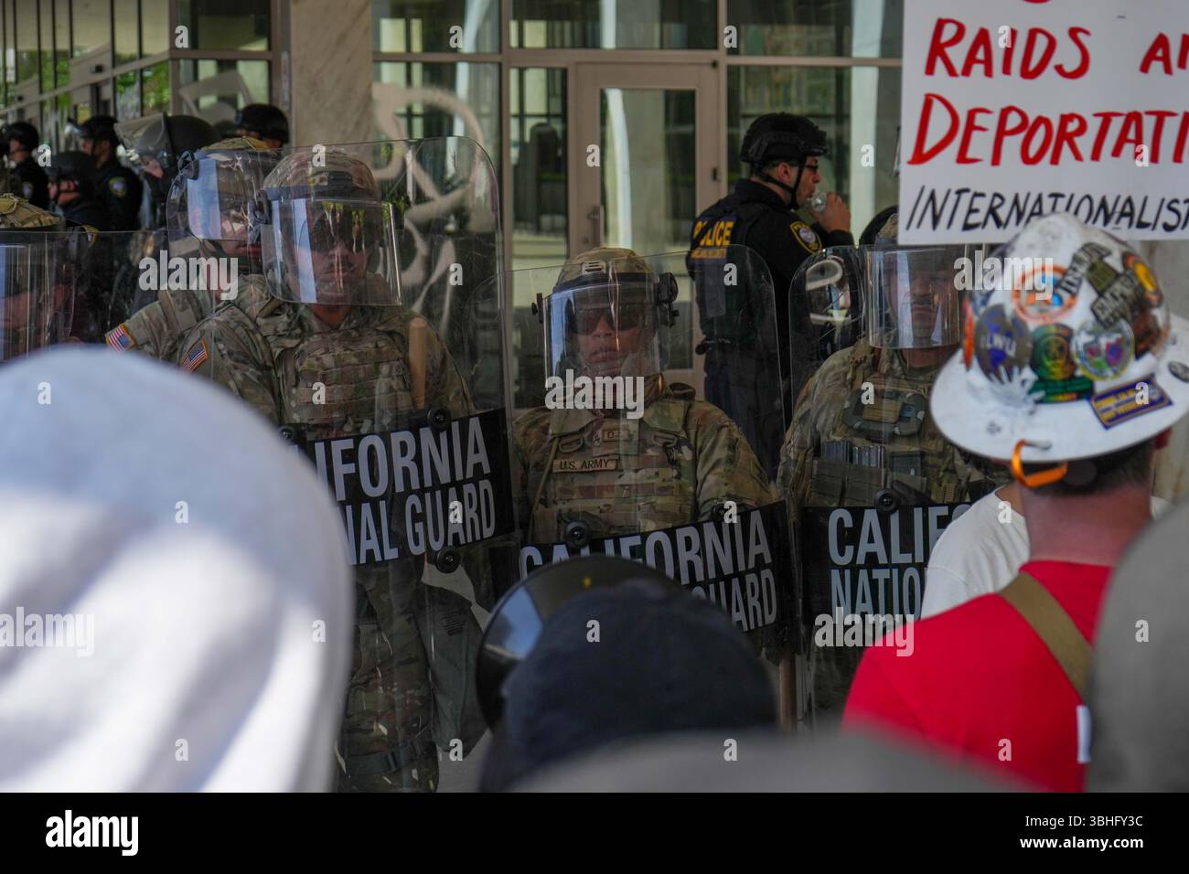 Protestors and California National Guard gather outside the Edward R ...