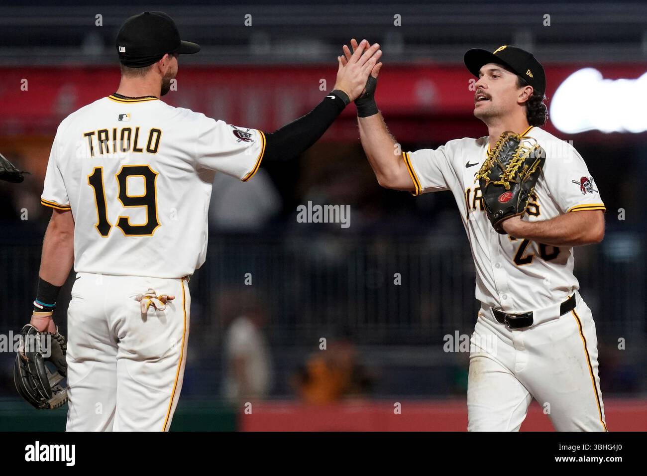 Pittsburgh Pirates second baseman Adam Frazier, right, celebrates with ...