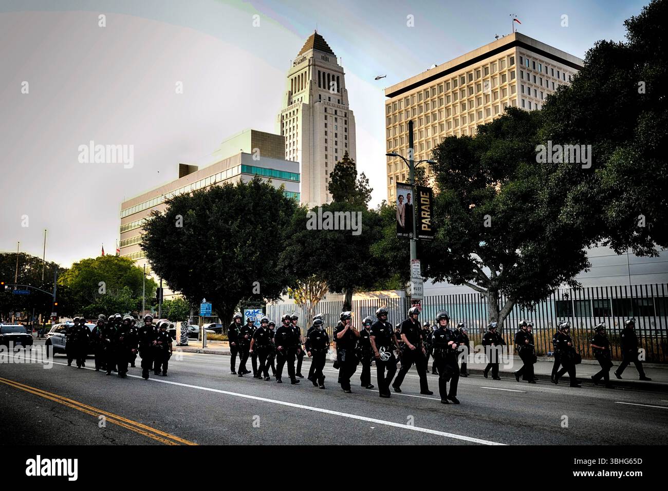 A Los Angeles police officers clear a street near Los Angeles City Hall ...