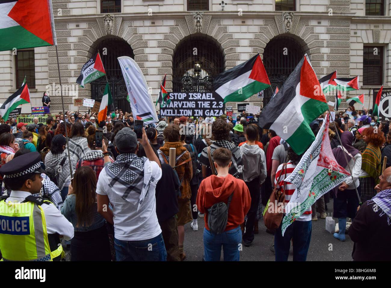 London, UK. 09th June, 2025. Protesters hold Palestinian flags and ...
