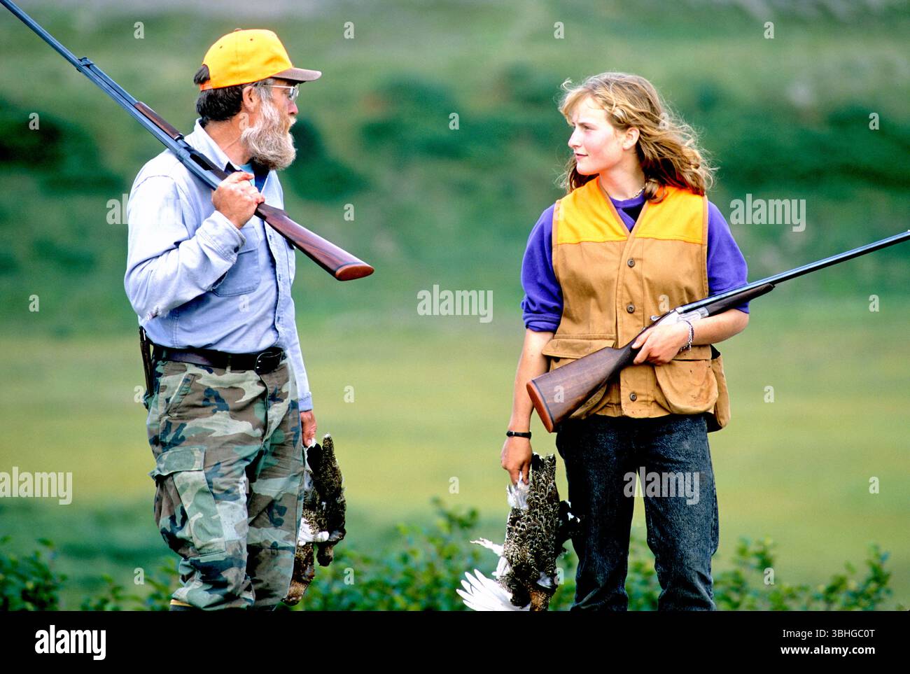 Father and daughter talking after bagging ptarmigan in Becharof ...