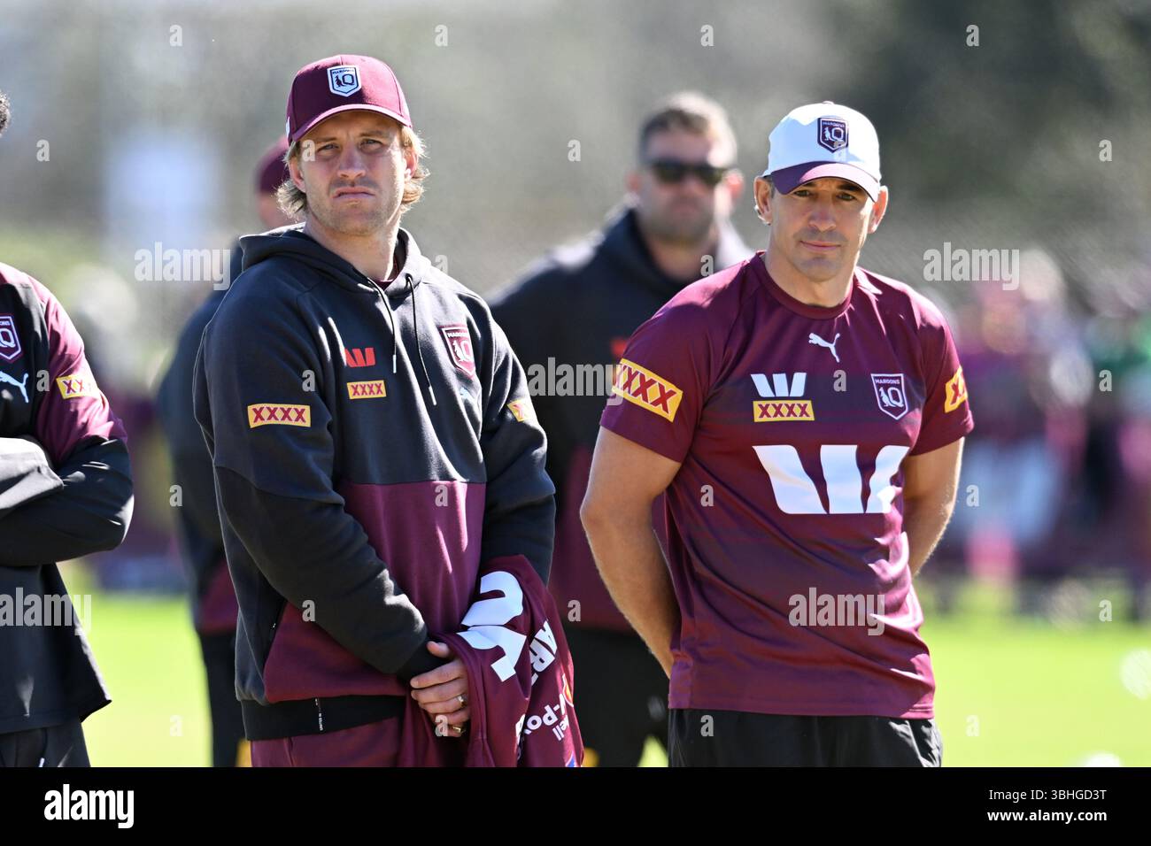 Cameron Munster (left) and Queensland coach Billy Slater (right) are ...