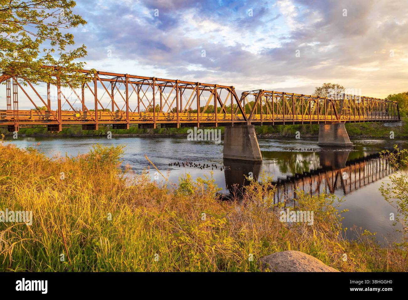 Golden sunset view of the River Lights Bridge at Phoenix Park in Eau ...