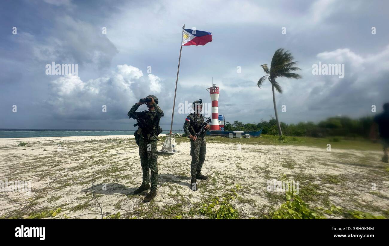 Philippine marines stand guard at West York Island, locally called ...