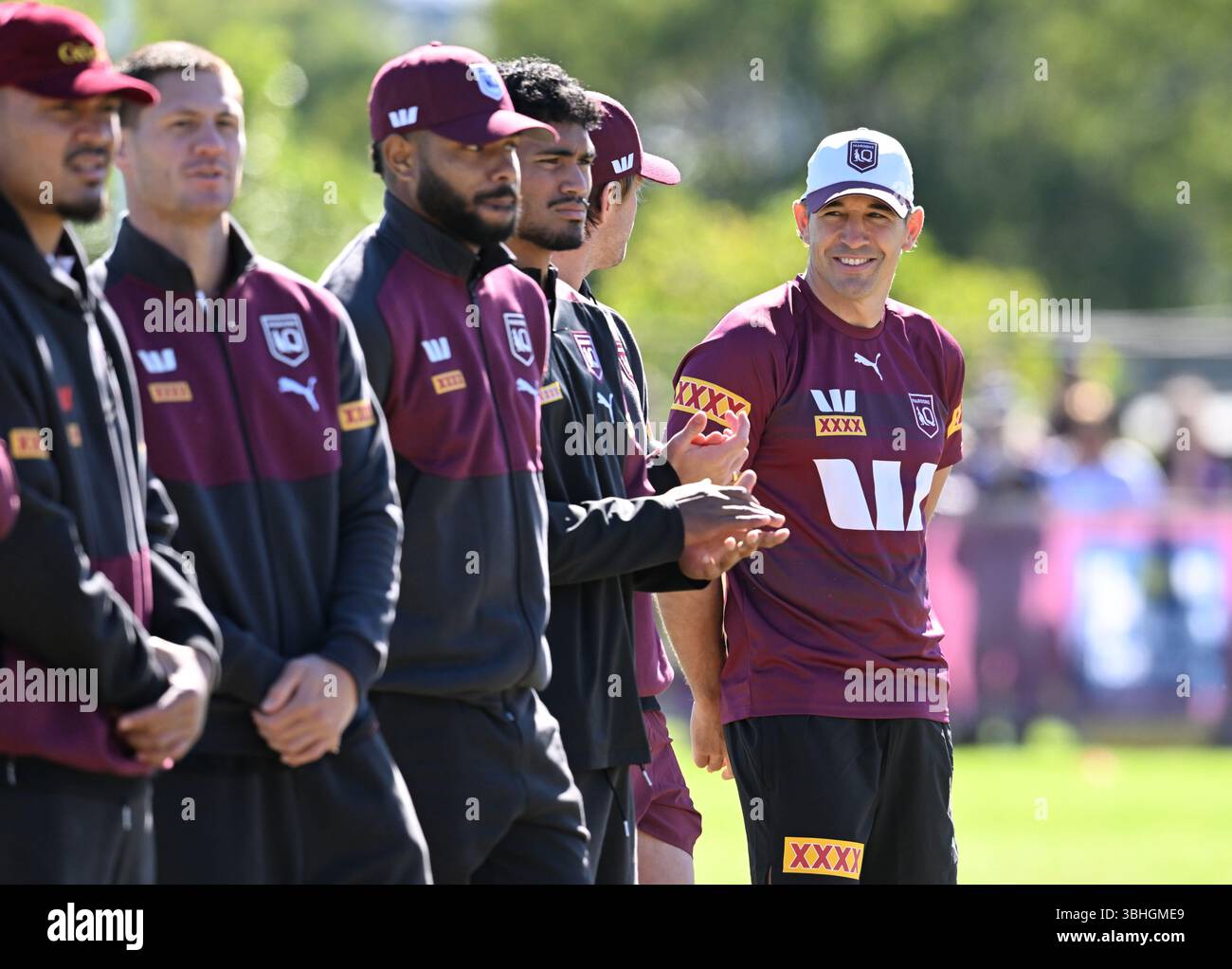 Queensland coach Billy Slater (right) is seen with his players during a ...