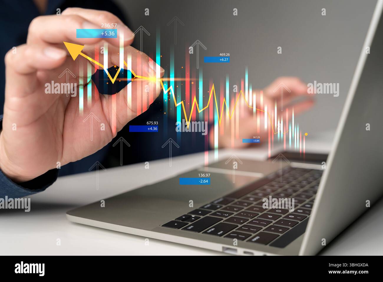 Business hand interacting with stock market graph, candlestick chart over laptop screen ...