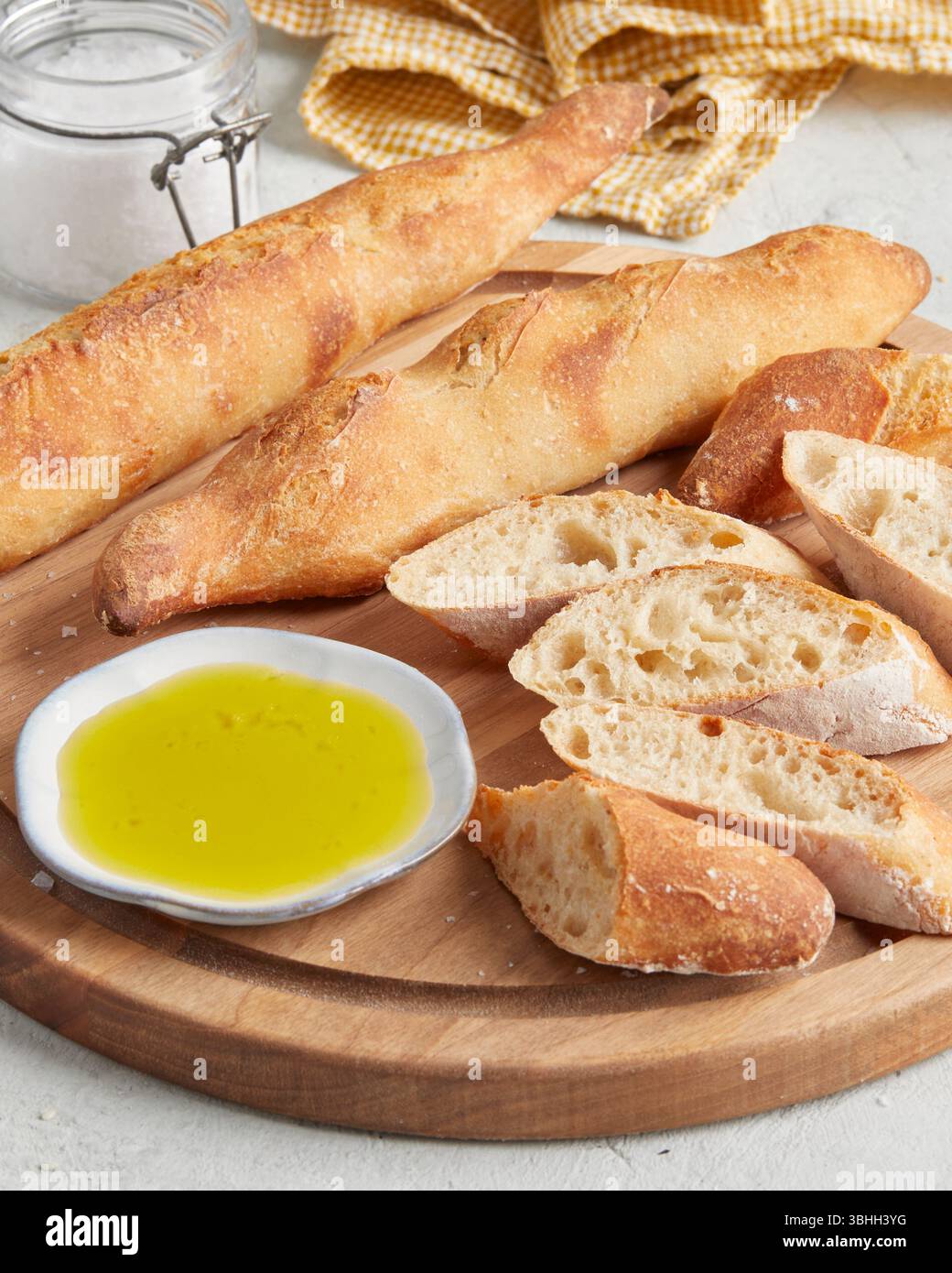 Baguette on cooling rack and wood surface – a rustic artisan loaf with ...