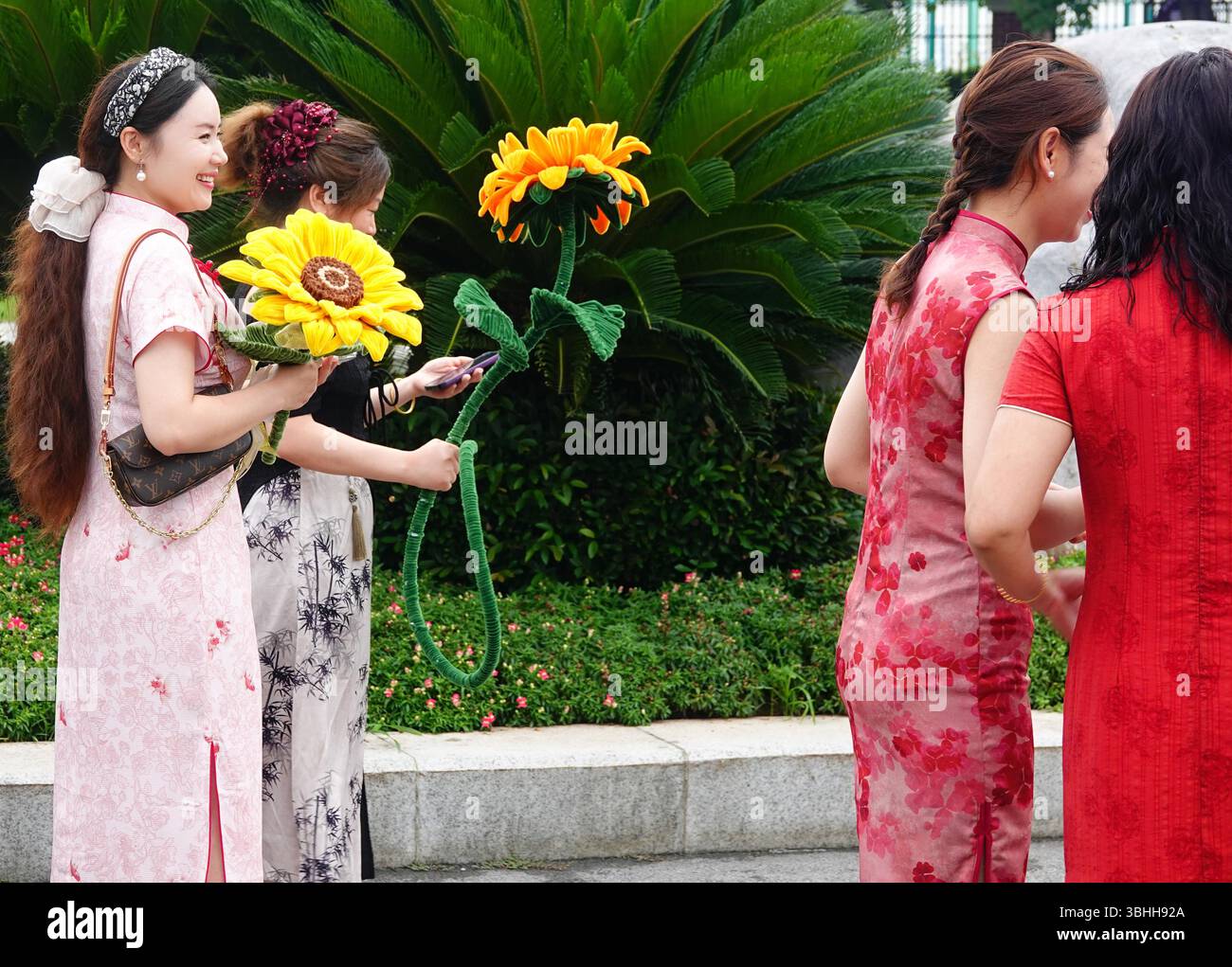 Family members cheer on the candidates outside an examination site in ...