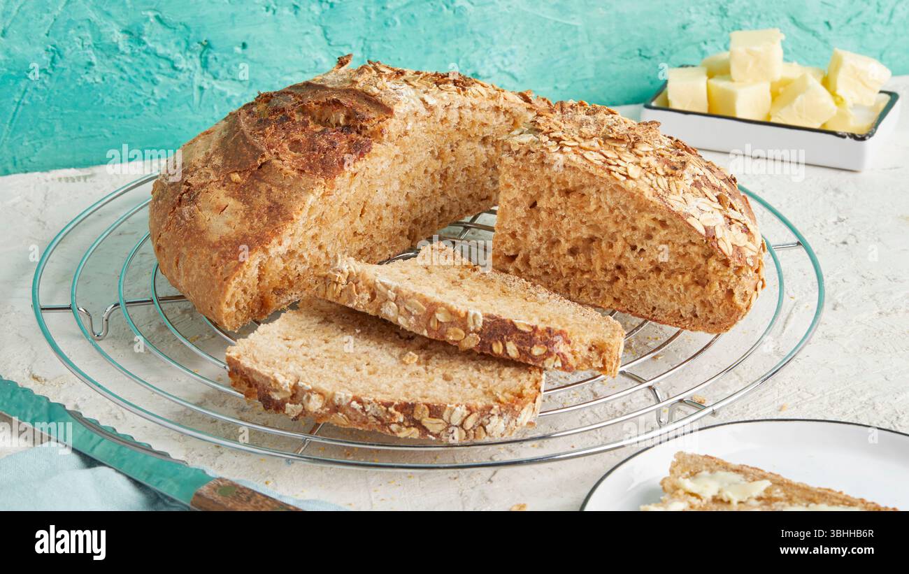 Spelt porridge bread on turquoise background – a healthy, rustic loaf ...