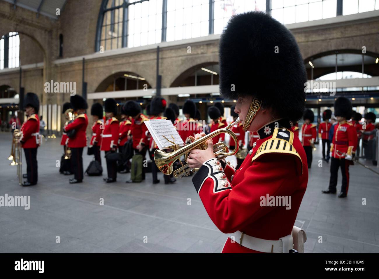 Members of The Coldstream Guards, wearing their full ceremonial dress ...