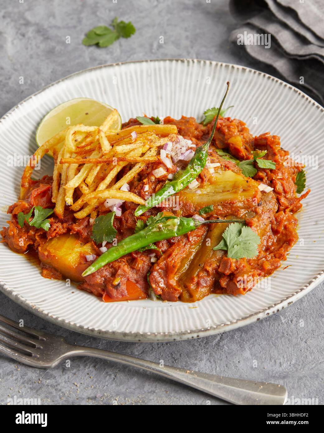 Rogan josh with eggplant on a plate – a spicy vegan curry inspired by ...