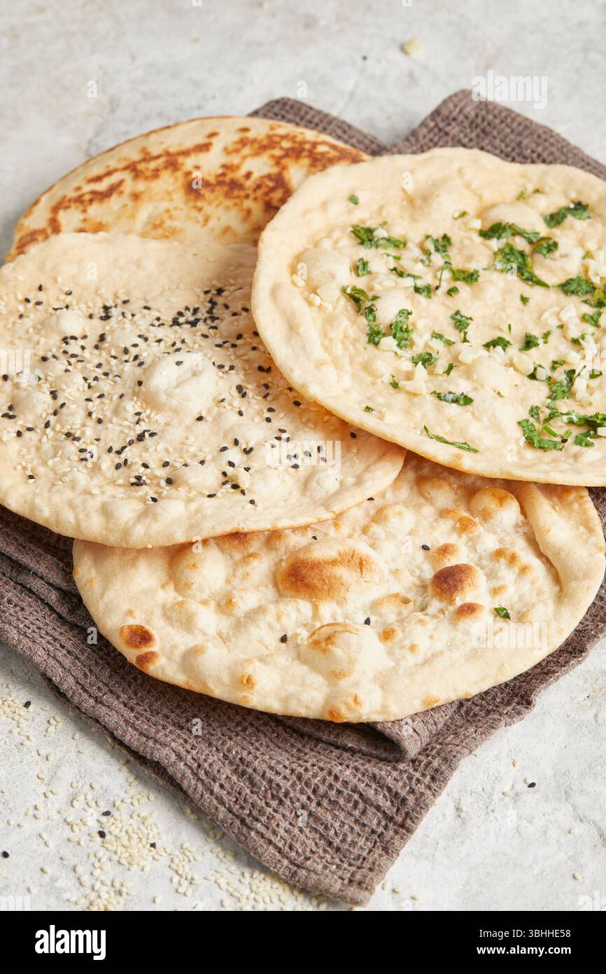 Garlic coriander naan – a traditional Indian flatbread topped with ...