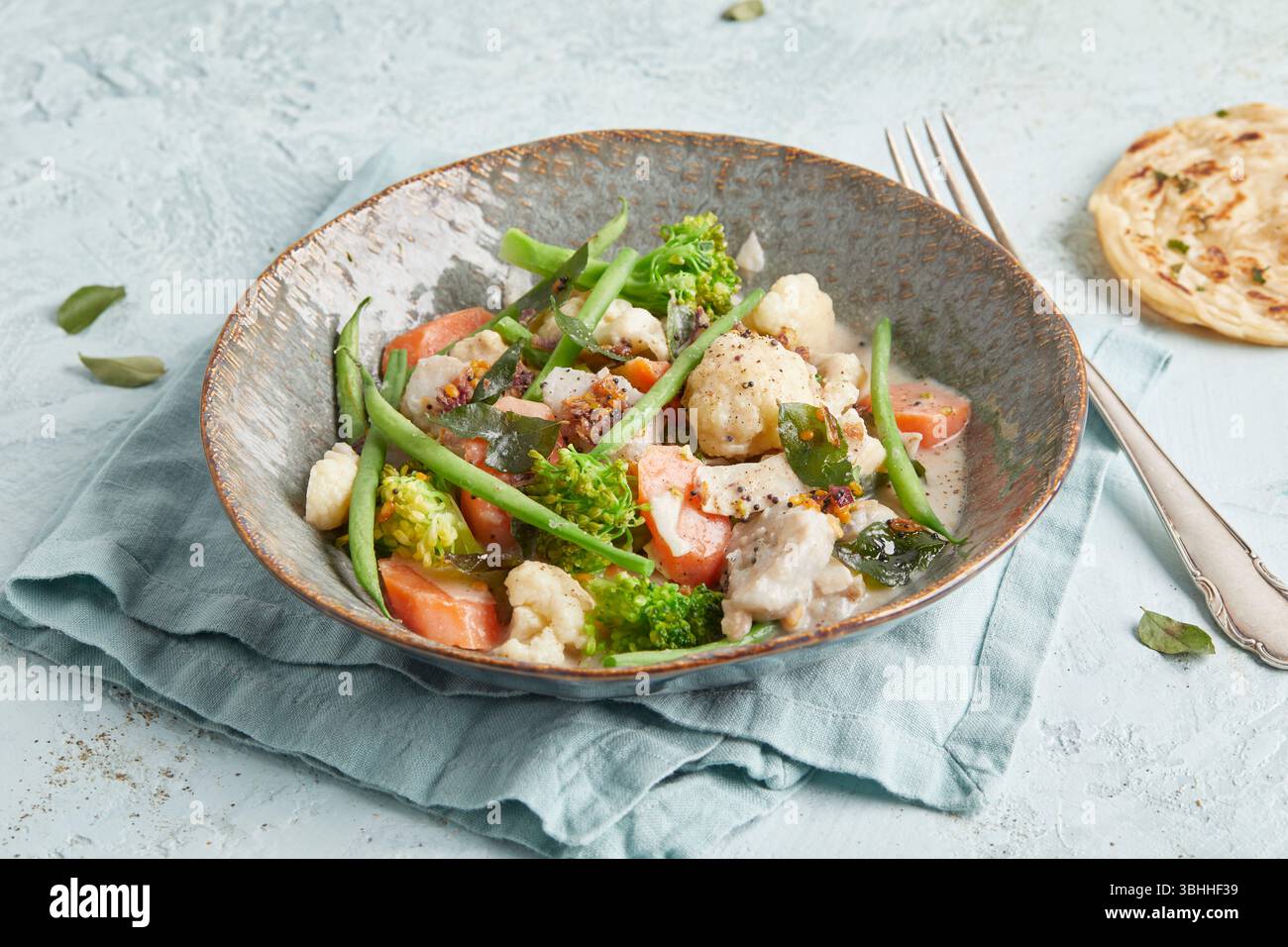 Avial vegetable curry in a bowl – a traditional South Indian dish with ...