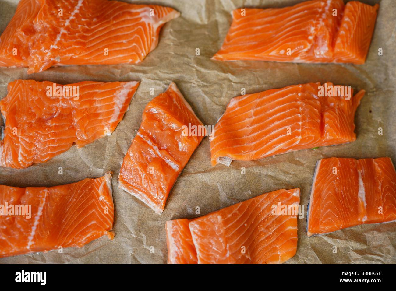 Fresh Raw Salmon Fillets on Parchment Paper Stock Photo - Alamy