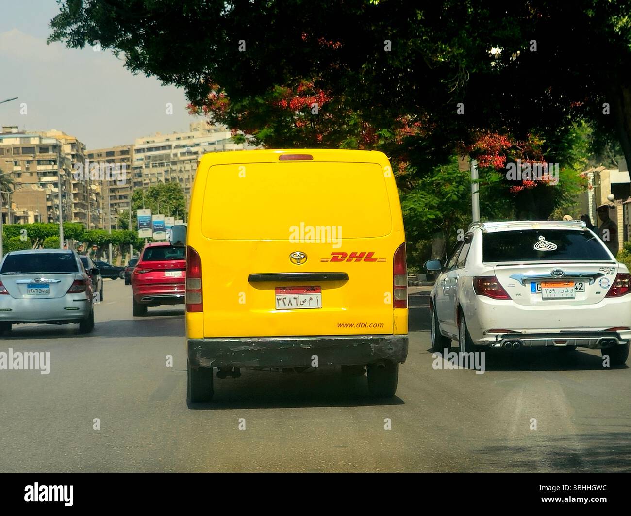 Cairo, Egypt, May 31 2025: DHL van truck on its way delivering a ...