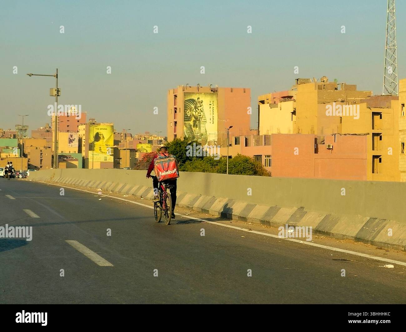 Giza, Egypt, June 8 2025: Talabat bicycle delivery service on the ring ...