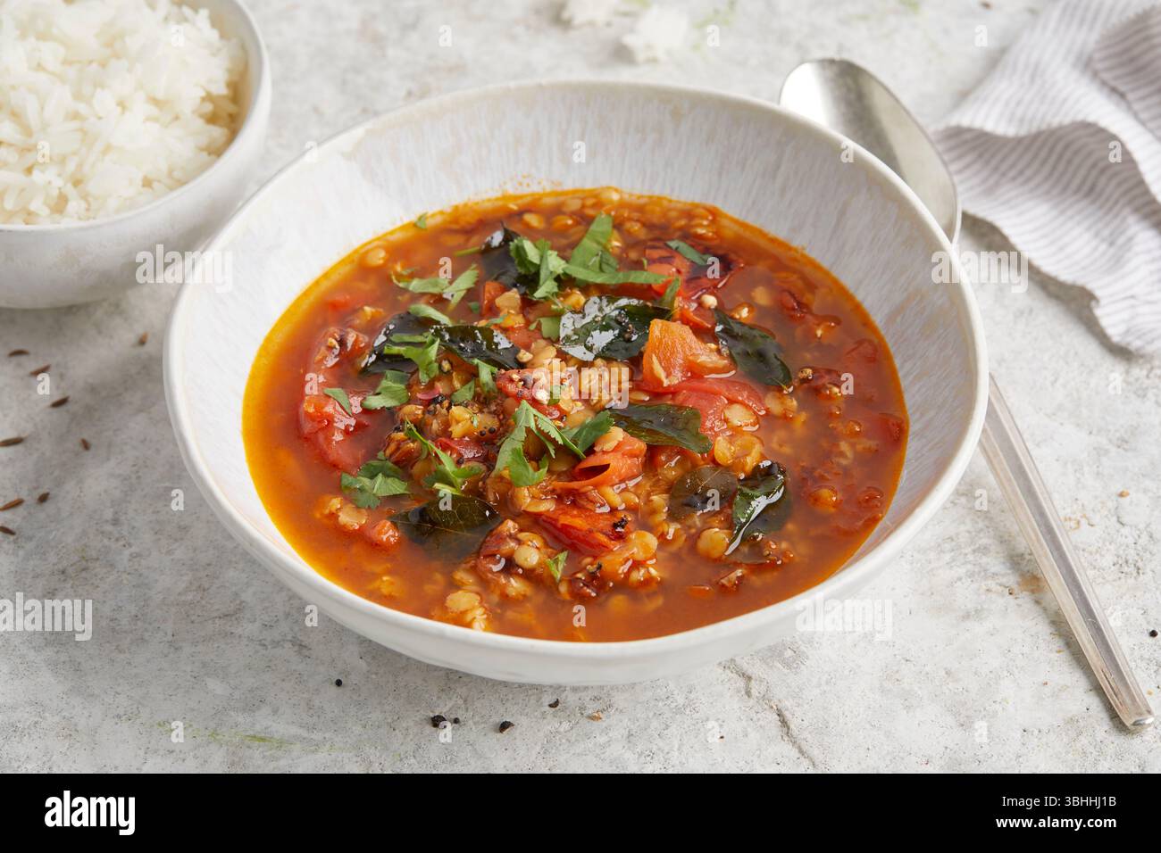 Rasam lentil soup in a bowl – a spicy South Indian vegan dish made with ...