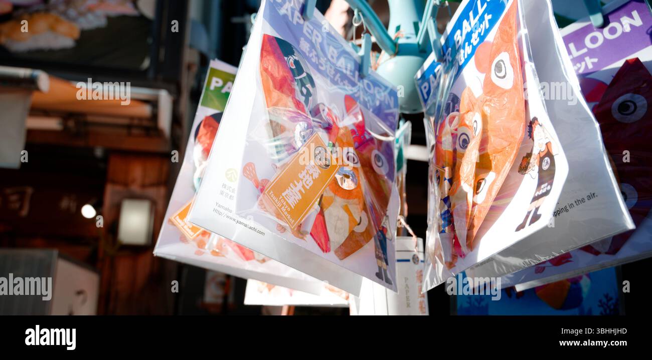 Colorful Japanese paper balloon sets (kamifusen) hanging on display ...