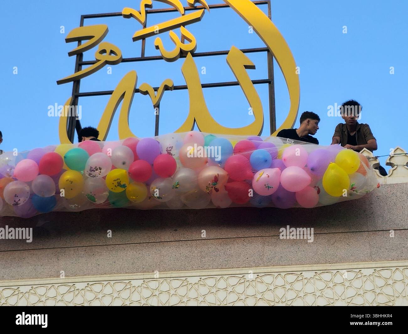 Cairo, Egypt, June 6 2025: Preparation to celebrate with kids in a mosque, throwing balloons ...