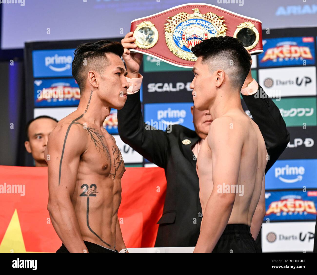 Vietnam's Van Thao Tran, left, and Japan's Tomoya Tsuboi face off during the official weigh-in ...