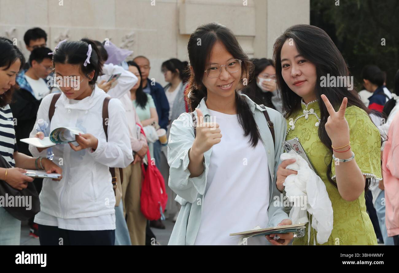 Candidates enter an examination site in Kunming City, southwest China's ...