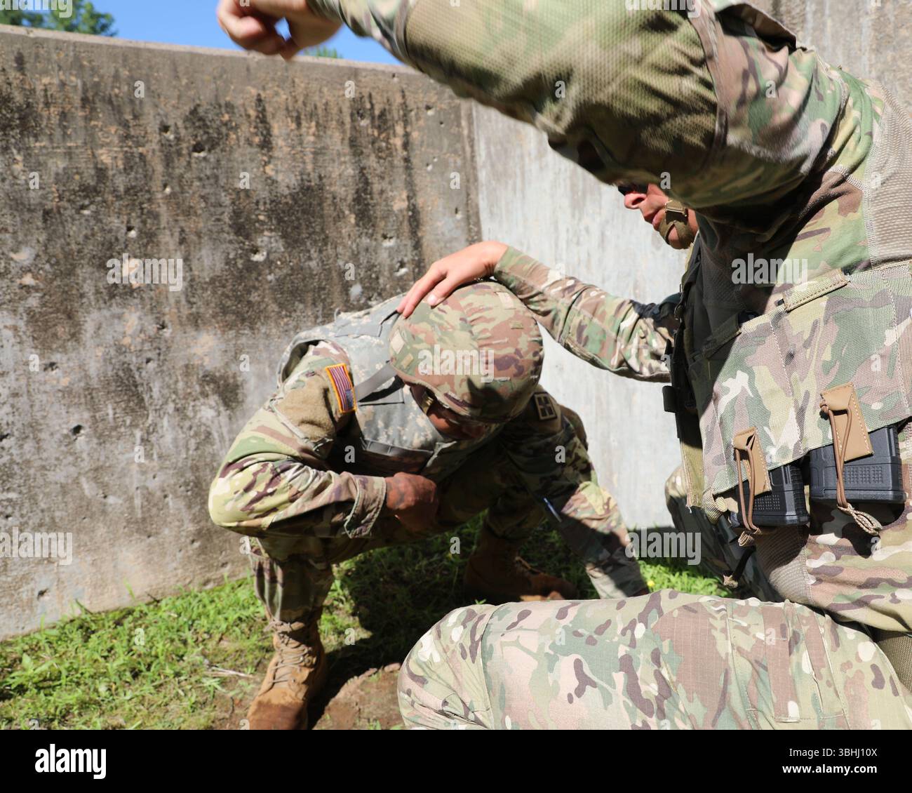 U.S. Army soldier, of the 467th Engineer Battalion, ducks hand grenade ...