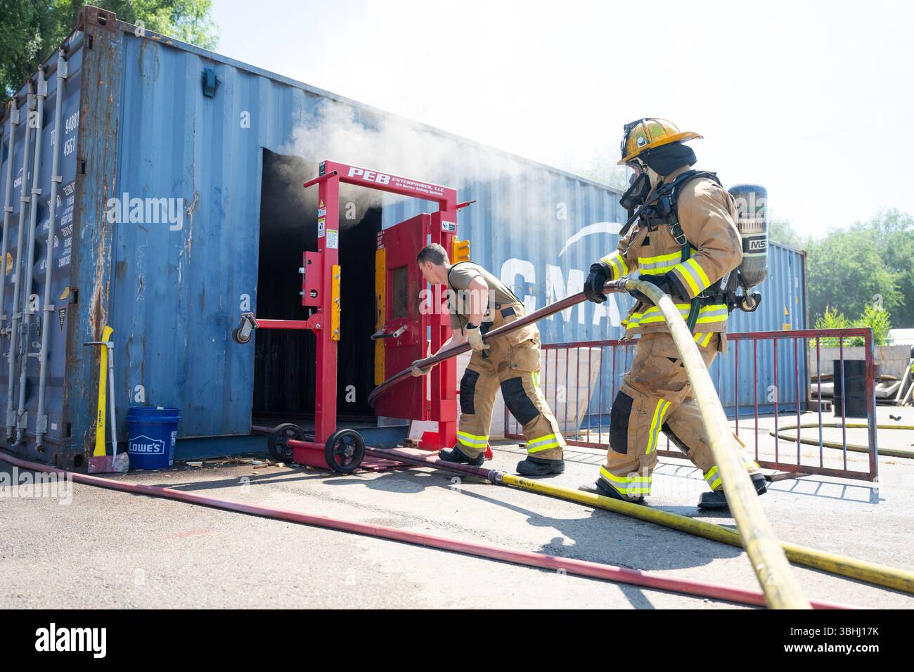 Airmen assigned to the Gowen Field Fire Department practice ...