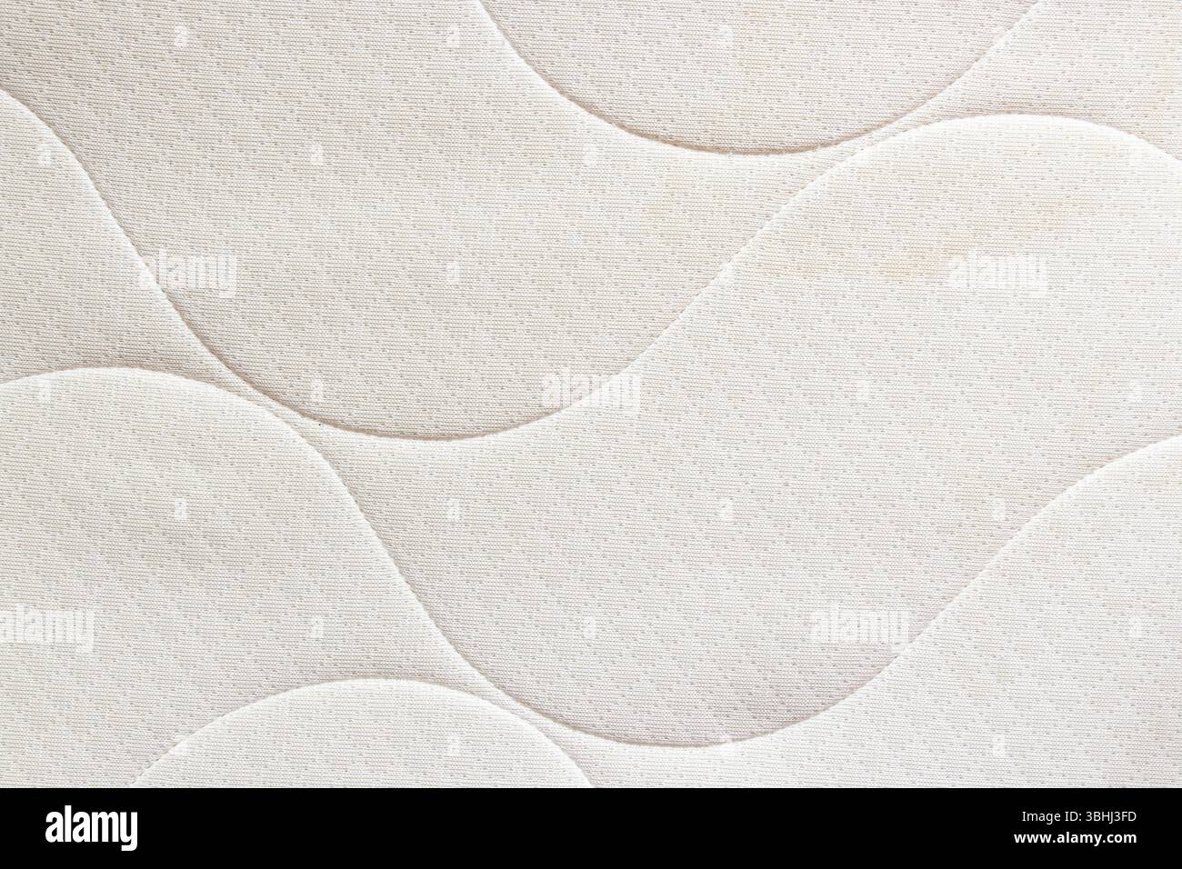 Light background of a mattress with wave stitching and fabric texture ...