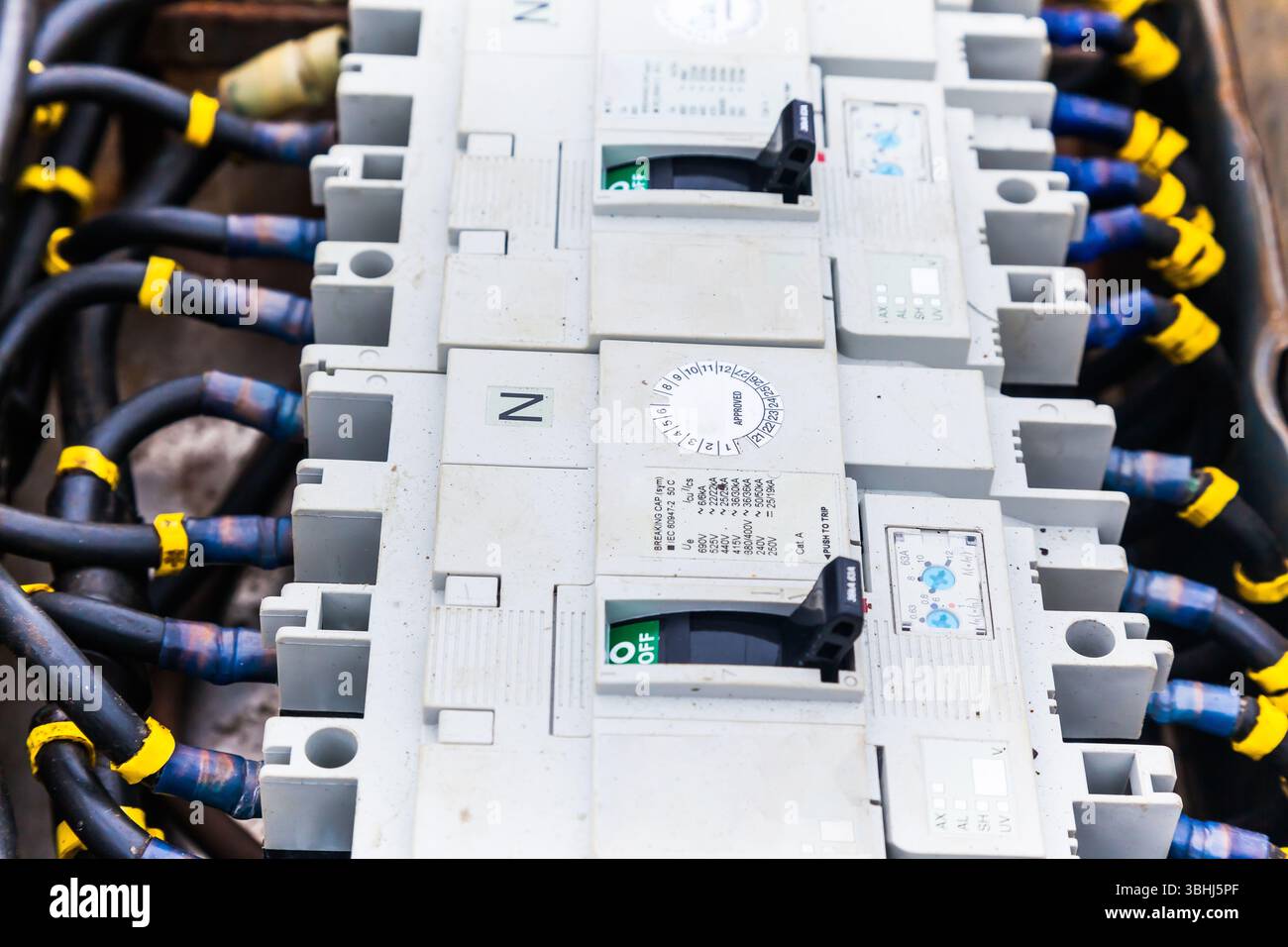 Electric cables connected to a distribution block with switches, close ...