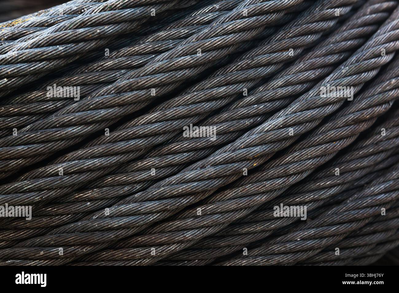 Steel twisted cable wound on a drum, next to each other, close-up Stock ...