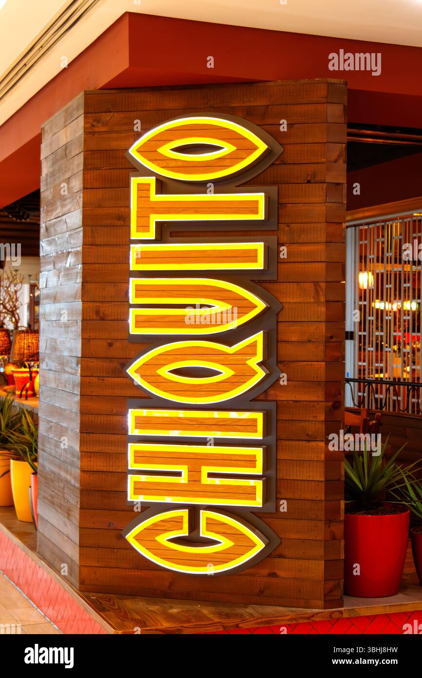 Brightly lit Chiquito restaurant sign glowing with warm colors ...