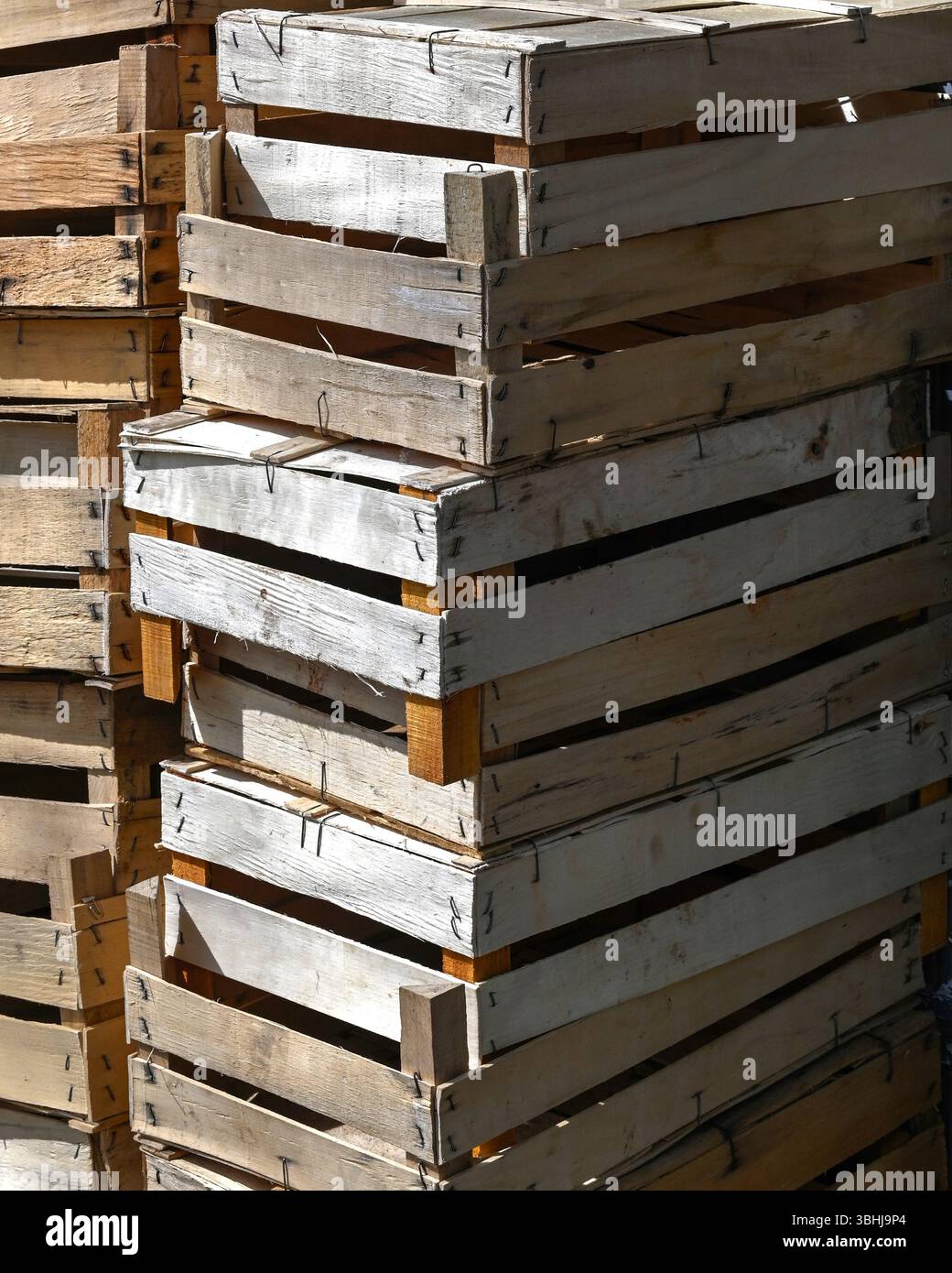 Stack of empty wooden fruit and vegetable boxes at a food market Stock ...