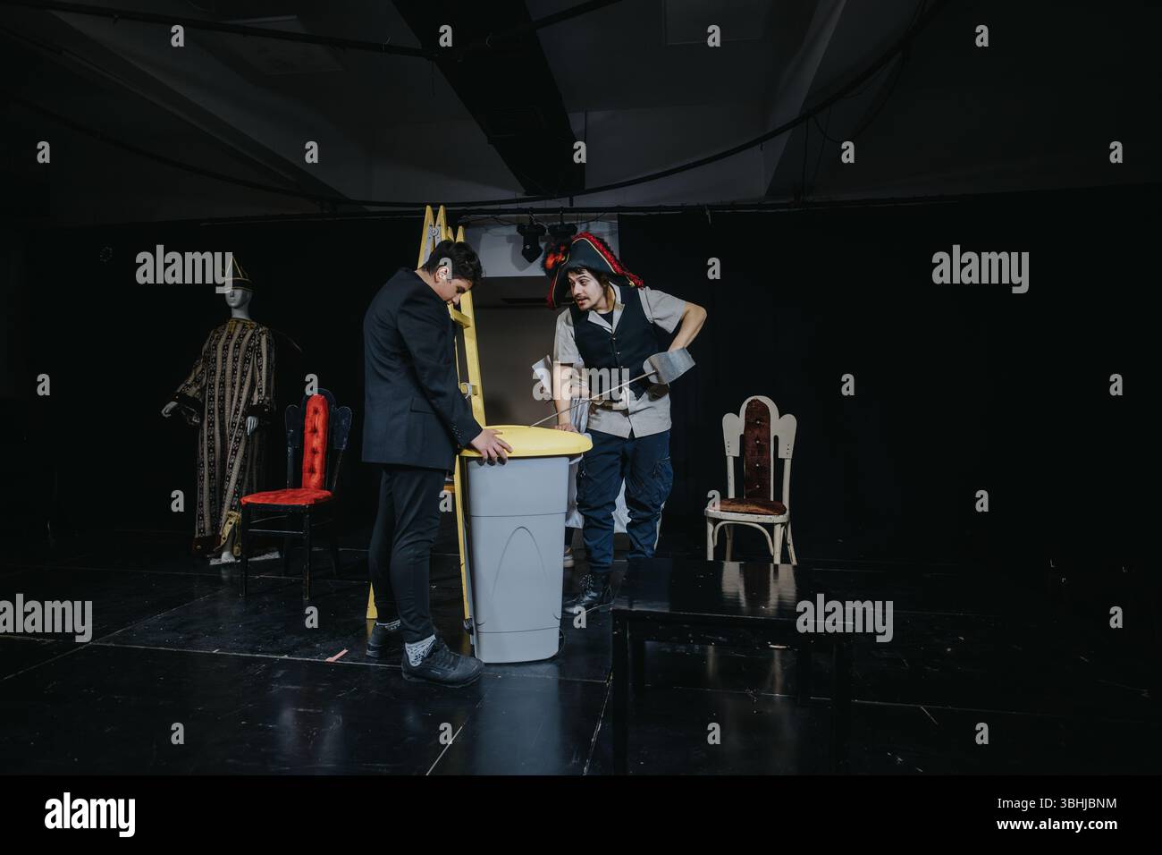 Theatrical performance depicting young actors in early drama with stage ...