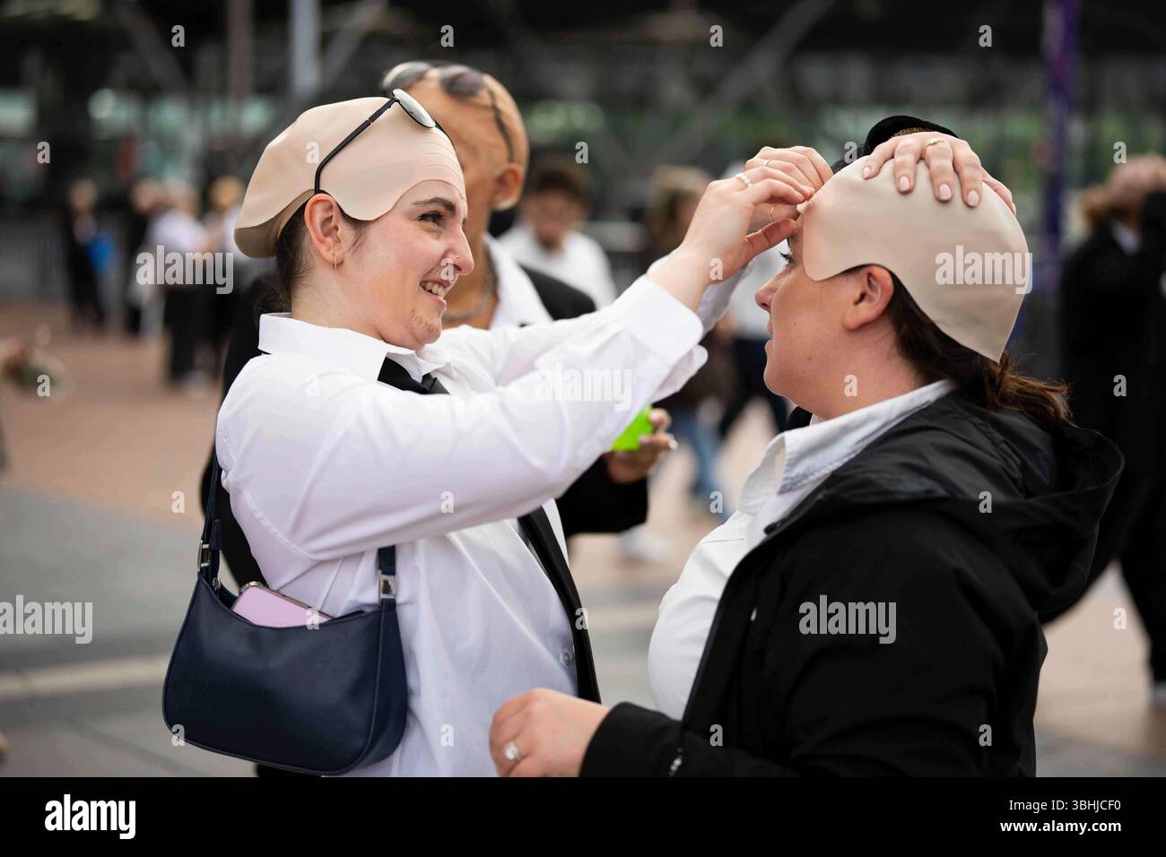 Fans apply costumes as they gather in front of the O2 Arena prior to a ...