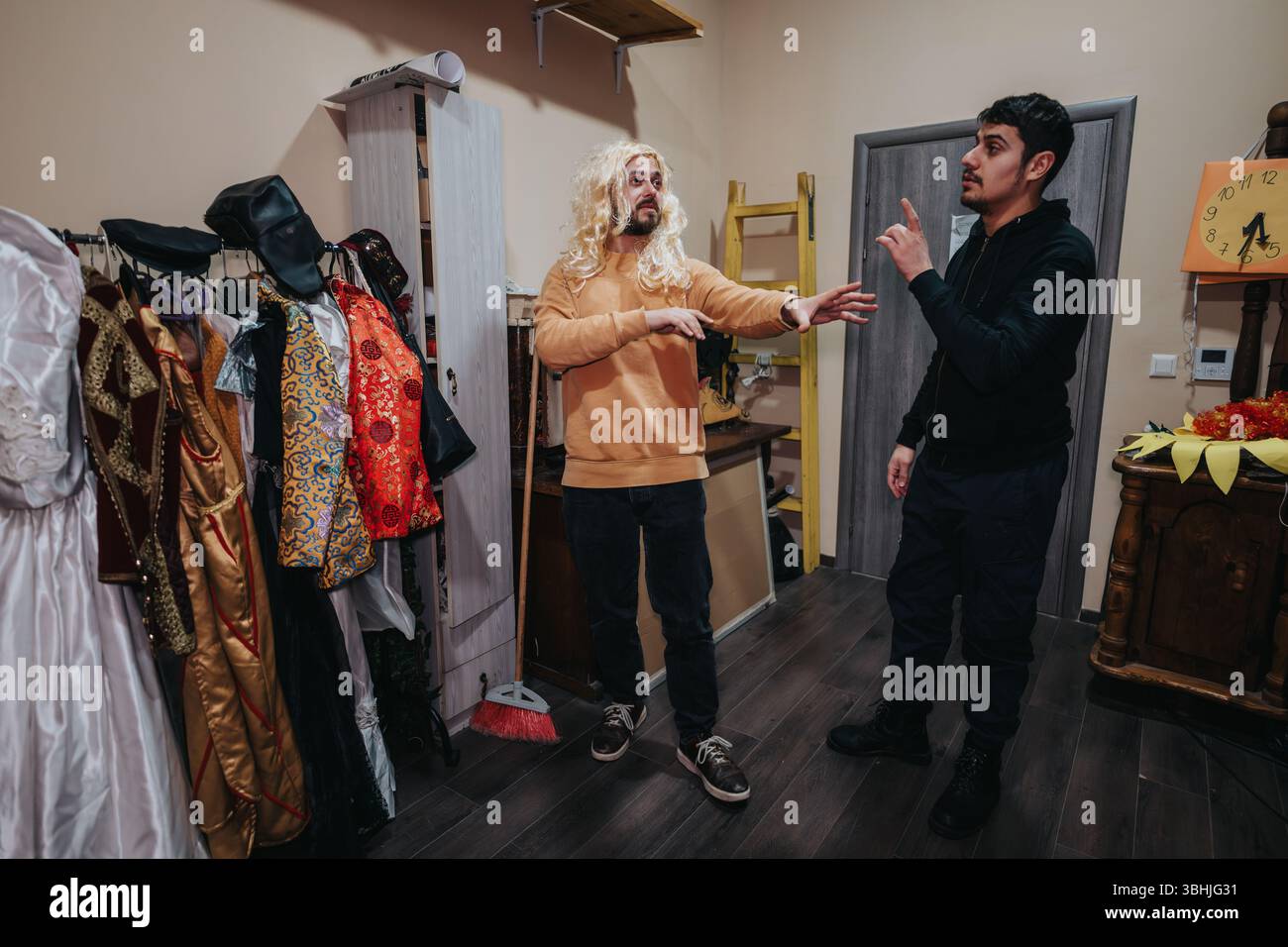 Actors Rehearsing in Costume Room with Theatrical Props and Outfits ...