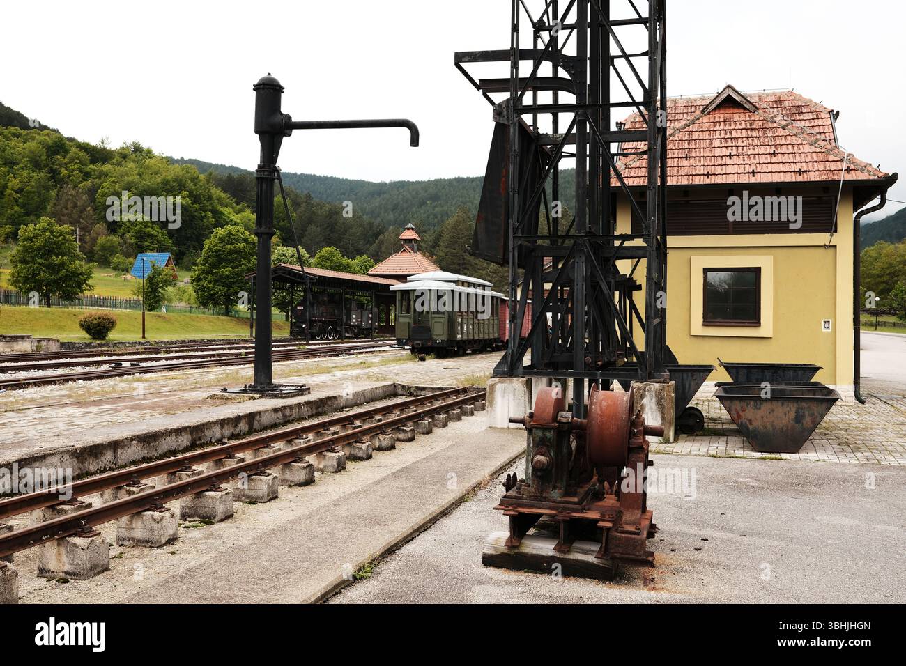 Old mechanical water pump and railway infrastructure in Shargan ...