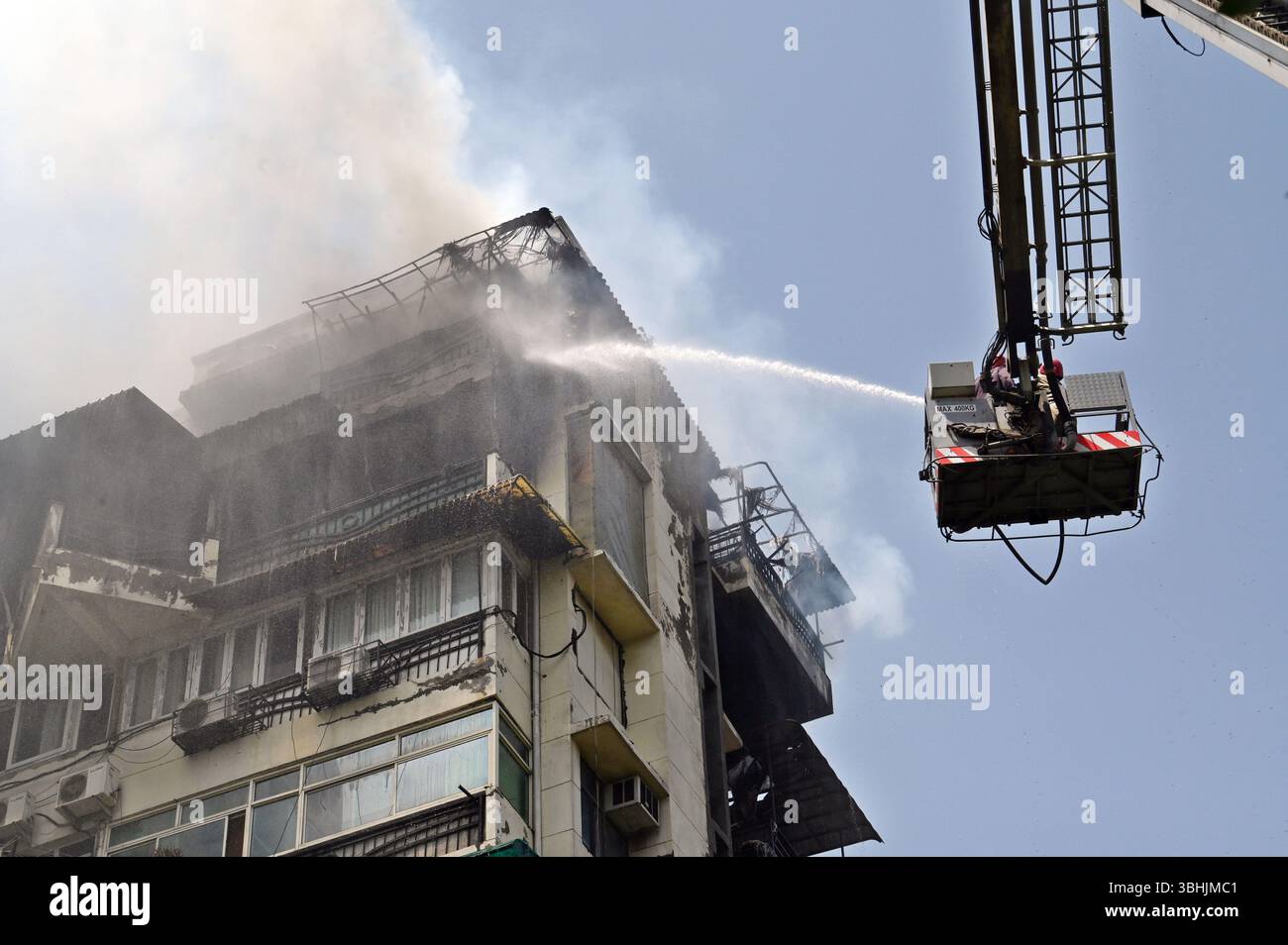NEW DELHI, INDIA - JUNE 10: Fire tenders douse the fire on the 10th ...