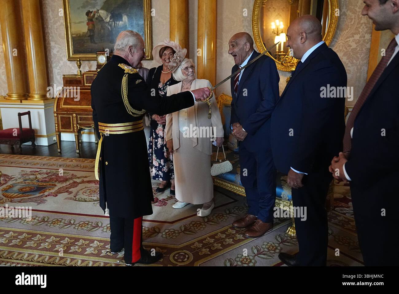 Rugby league star Billy Boston being Knighted by King Charles III at ...