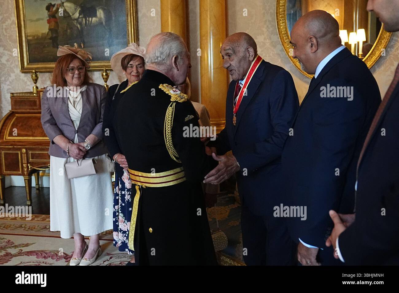 Rugby league star Billy Boston being Knighted by King Charles III at ...