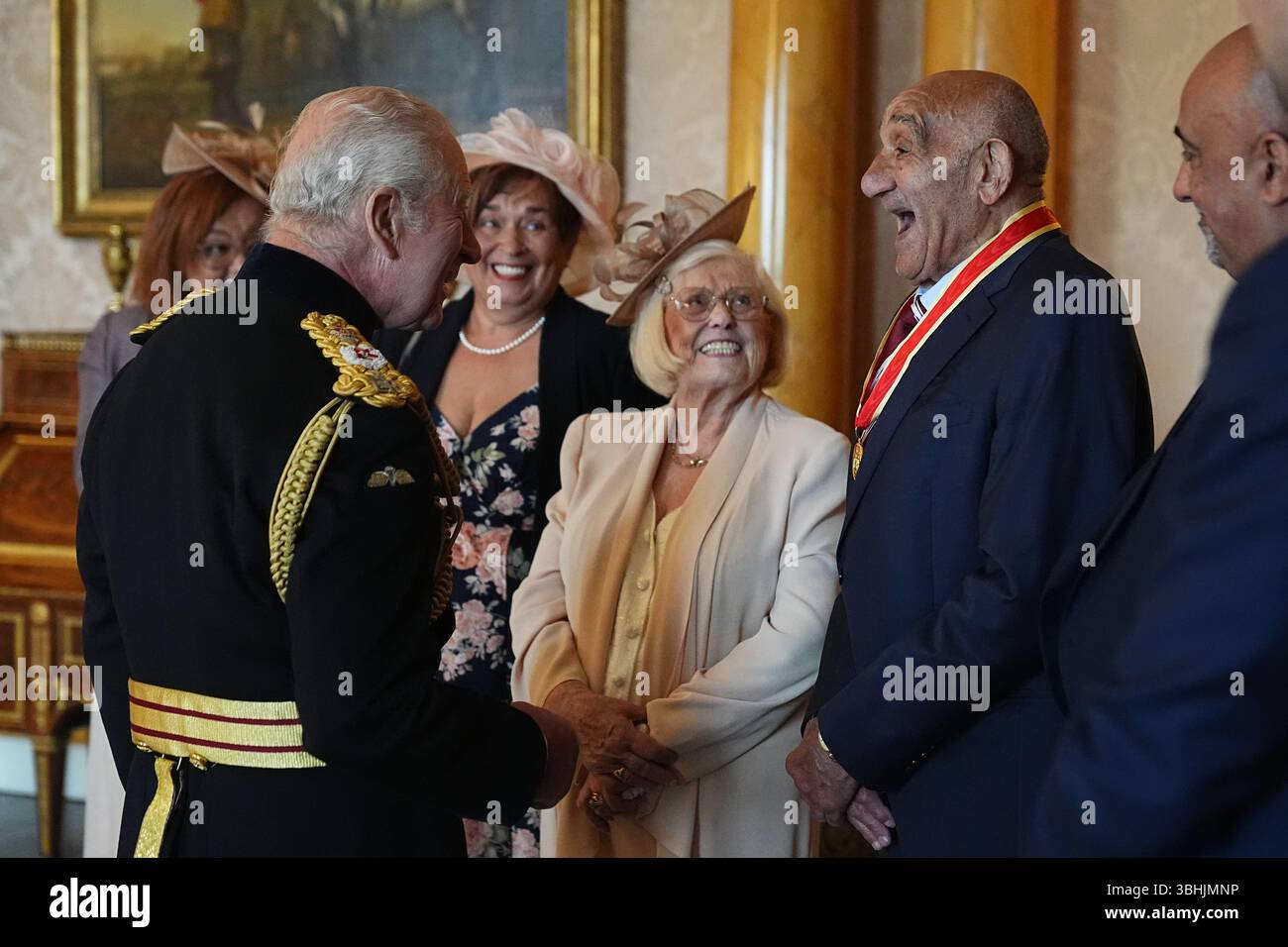 Rugby league star Billy Boston being Knighted by King Charles III at ...