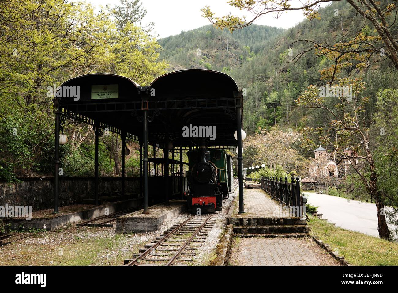 Historical narrow-gauge steam train at Sargan eight station. Mokra gora ...